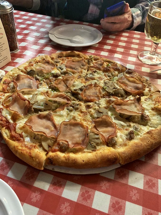 Pizza and beer - a match made in heaven, served on a red and white checkered slice of Americana.