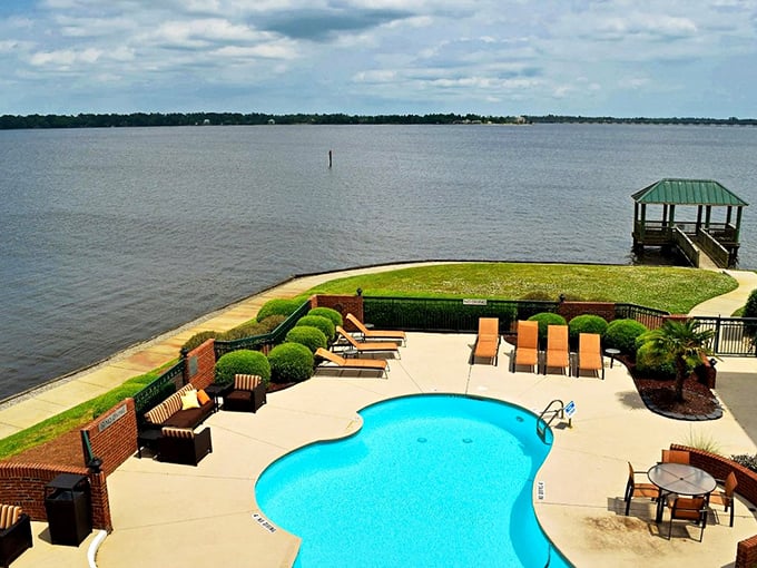Poolside paradise with a view! It's like someone dropped a resort oasis right into New Bern's backyard.