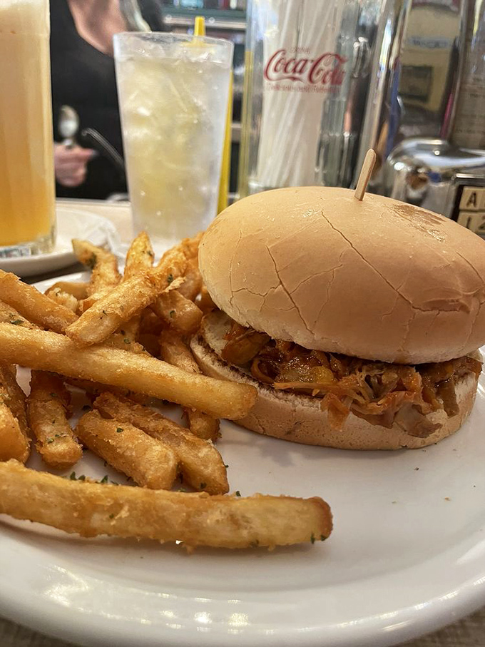 Holy pulled pork, Batman! This sandwich looks so good, it might just make you want to do the twist. Tender, saucy, and oh-so-satisfying!