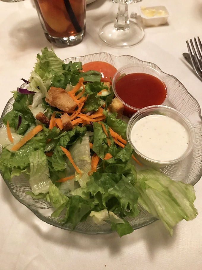 A salad that knows its supporting role in the meat-centric drama, yet performs with enough personality to earn its place.