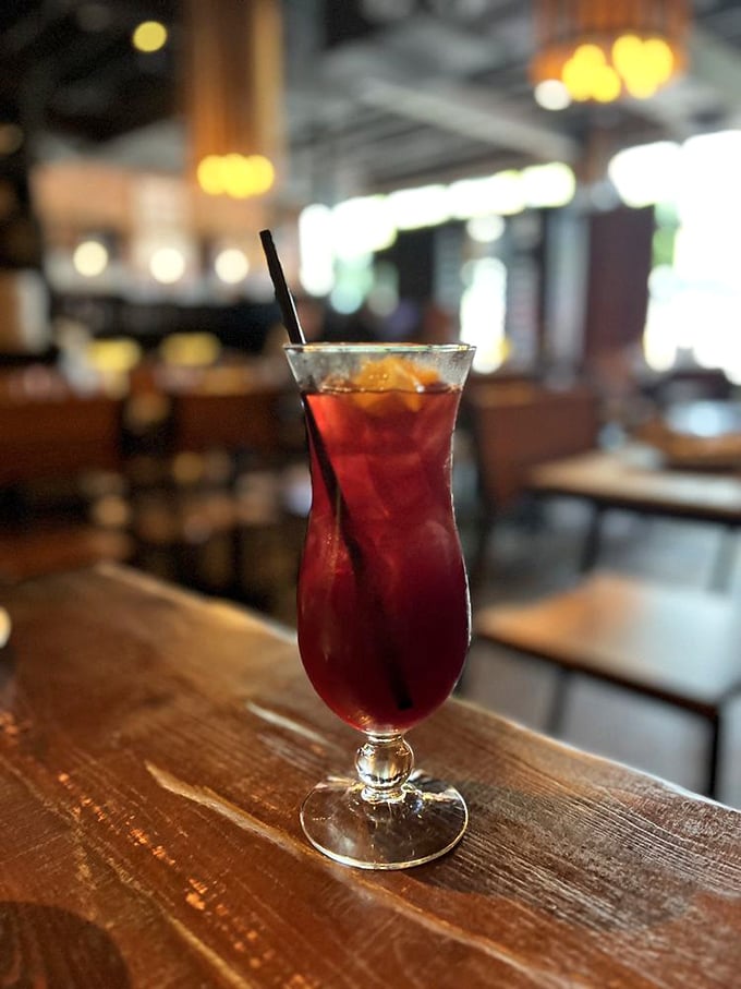 The sangria arrives like a ruby-colored reminder that sometimes the best moments happen when you're not checking your watch.