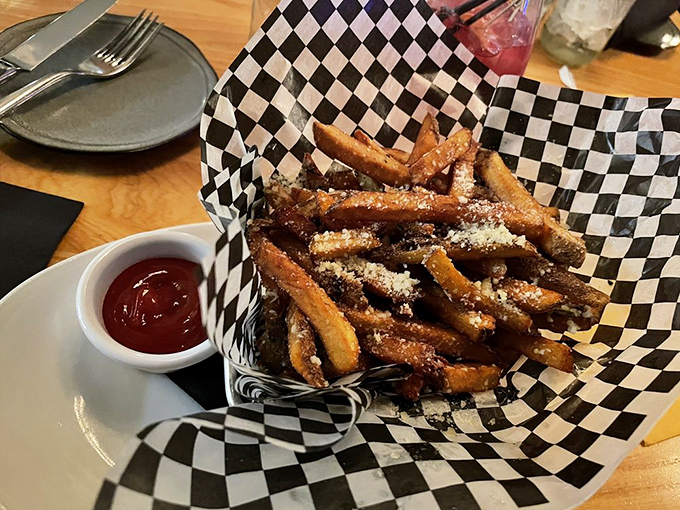 Truffle fries dusted with parmesan &ndash; the side dish that consistently steals the spotlight and refuses to apologize for it.