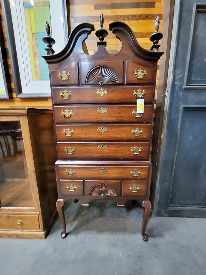 This isn't just a dresser; it's a time capsule with drawers. Colonial chic meets modern bargain hunter's dream.