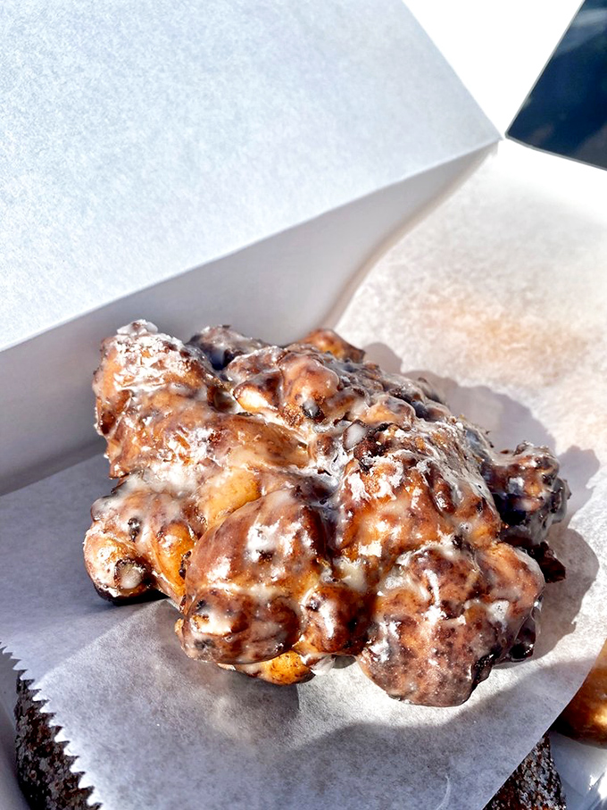 Holy fritter, Batman! This apple fritter looks like it could single-handedly solve world peace &ndash; or at least make your taste buds incredibly happy.