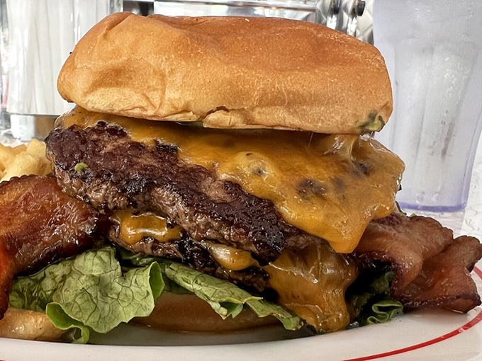 This isn't just a burger, it's a skyscraper of flavor! Prepare for a delicious adventure that requires both hands and zero shame.
