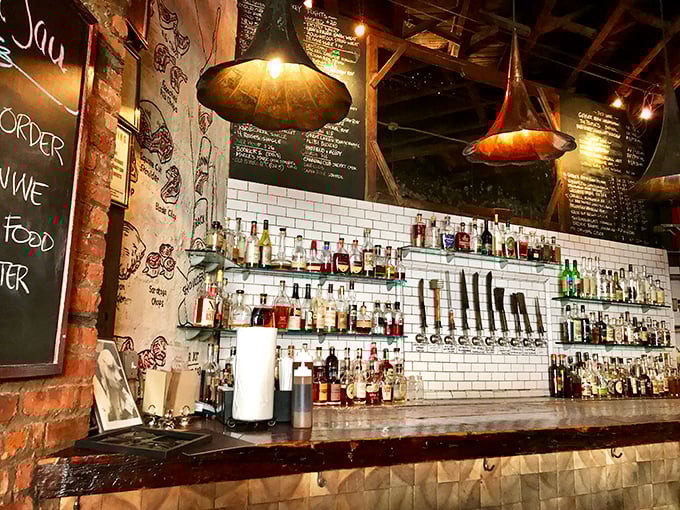 The bar at Fette Sau doesn't mess around. With whiskey bottles lined up like soldiers, they're ready for the barbecue battles ahead.