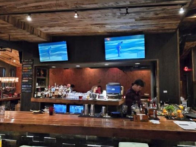 The bar doesn't just serve drinks&mdash;it showcases the art of hospitality with craftsmanship that matches the food's attention to detail.