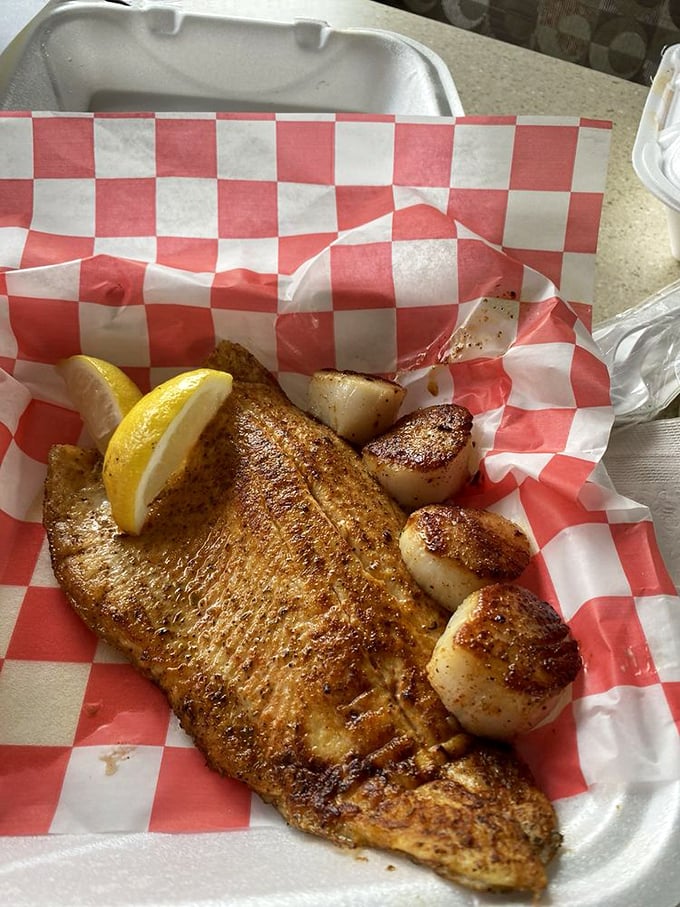 Blackened trout that's anything but basic, paired with scallops so perfectly seared, they could make Gordon Ramsay weep with joy.