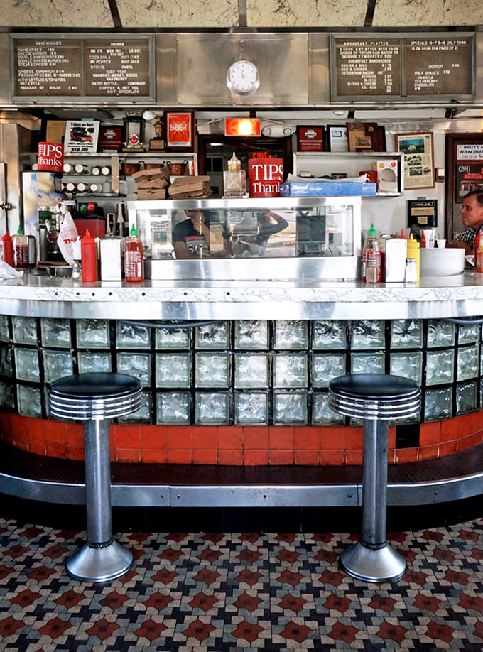 Pull up a seat at the altar of burgers! This counter is where slider dreams come true and diet resolutions go to die.