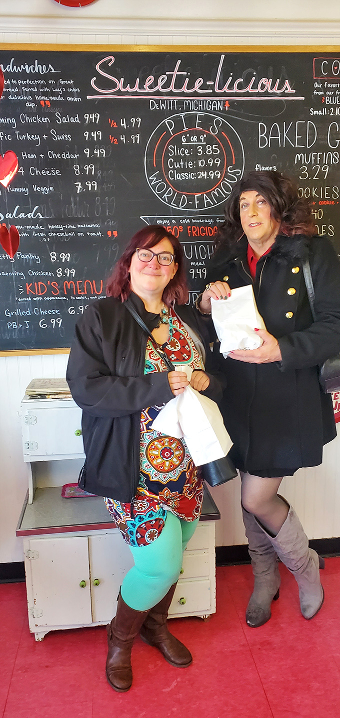 Pie enthusiasts unite! These happy customers know the secret to life: good company, great pie, and a chalkboard full of possibilities.