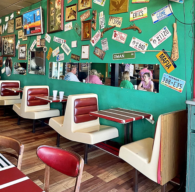 A wall of wonders! This eclectic decor is like a road trip through America's quirkiest attractions, all without leaving your seat.