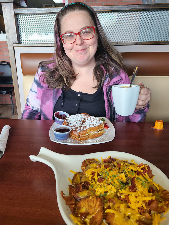 A happy diner is a beautiful sight! This smiling patron proves that good food is the ultimate mood enhancer. Pass the syrup, please!