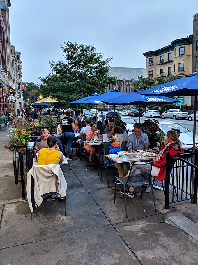 Happy diners, united in their quest for the perfect burger. It's like a support group, but with better food and no talking about feelings.