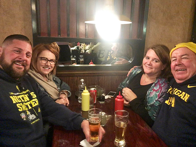 Happy faces and full bellies! These diners know they've stumbled upon a Michigan treasure. Can you spot the look of burger-induced joy?