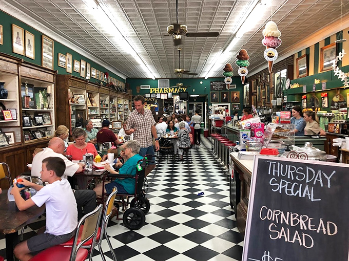 Lunchtime buzz! Borroum's dining area is like a scene from "Cheers" &ndash; where everybody knows your name, and your favorite sandwich order.