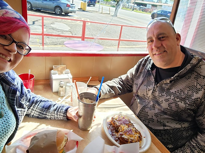 Happy diners, happy times! There's nothing quite like the joy of sharing a great meal with good company. Can you feel the burger-fueled contentment?