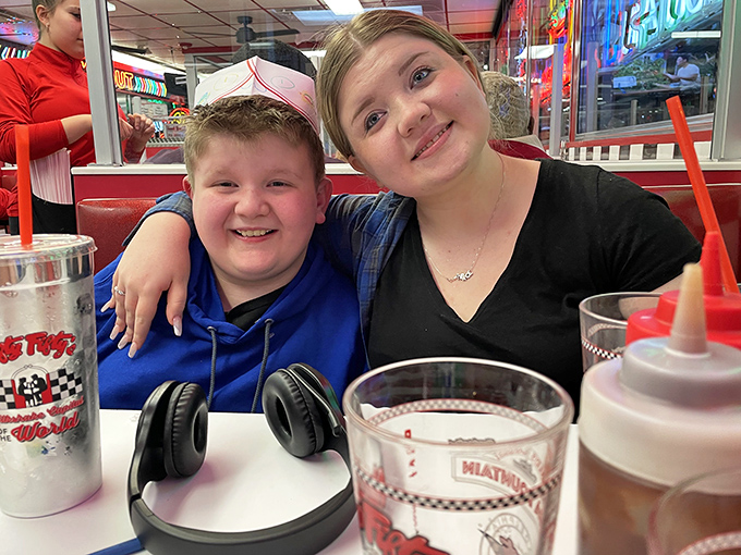 Happy days are here again! These smiling diners prove that good food and good company are always in style.