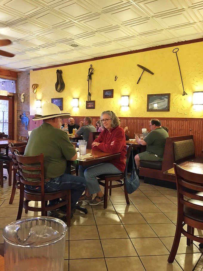 Local flavor in action! These folks aren't just eating; they're participating in a time-honored Sheridan tradition of good food and even better company.