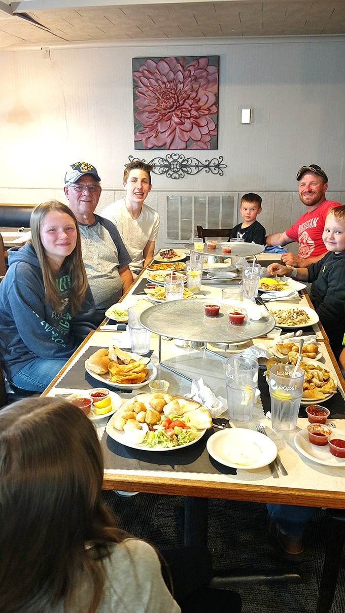 Family feast in progress! This table spread looks like the United Nations of comfort food &ndash; bringing people together one bite at a time.
