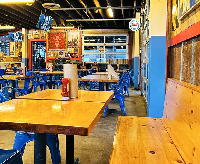 Feast for the senses! This dining area is a perfect blend of rustic charm and modern comfort, like a barbecue joint designed by Chip and Joanna Gaines.