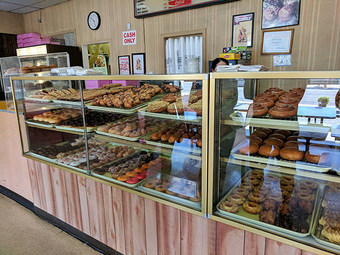 Feast your eyes on this treasure trove of temptation. It's like Willy Wonka opened a donut shop, and we're all golden ticket winners.