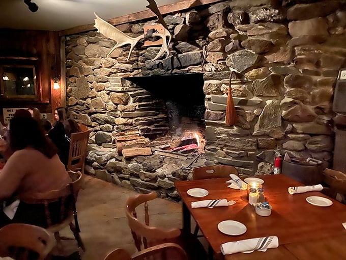 Who needs a Yule log when you've got this cozy fireplace? It's like dining in a warm, stone-wrapped hug.