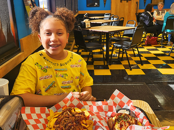 Happiness is a full plate and an empty schedule. This young diner knows the secret to a perfect day.
