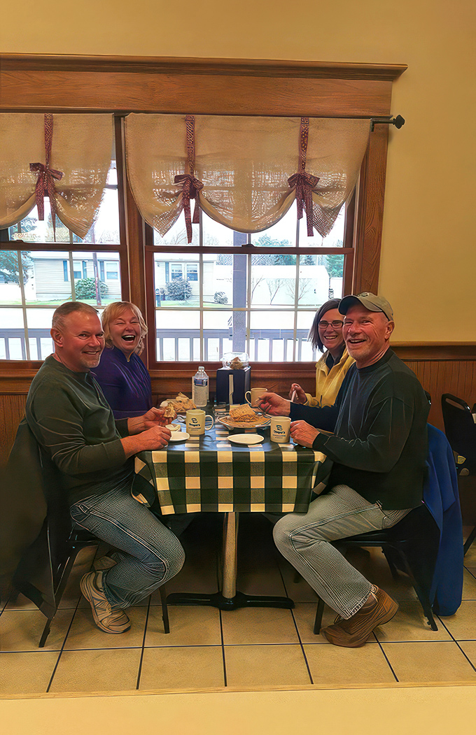 Happy diners caught in the act of pure joy. Looks like they've found the secret to happiness: good food and great company.