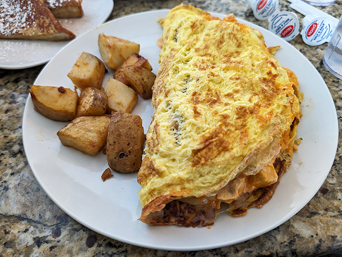 An omelet so big, it has its own zip code. Packed with goodies, it's a treasure hunt for your fork.