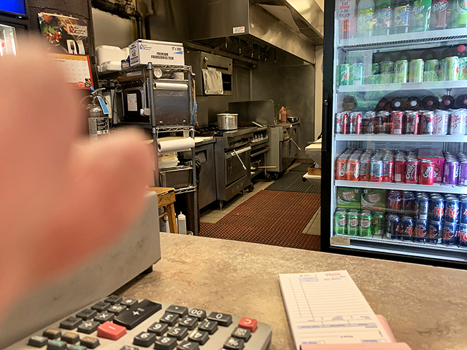 Behind the scenes of flavor town! This kitchen might not be glamorous, but it's where the magic happens. Cue the mouthwatering anticipation.