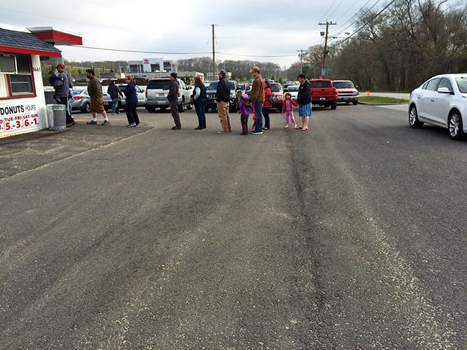 The great donut pilgrimage! Rain or shine, these dedicated souls brave the elements for a taste of Allie's circular perfection.