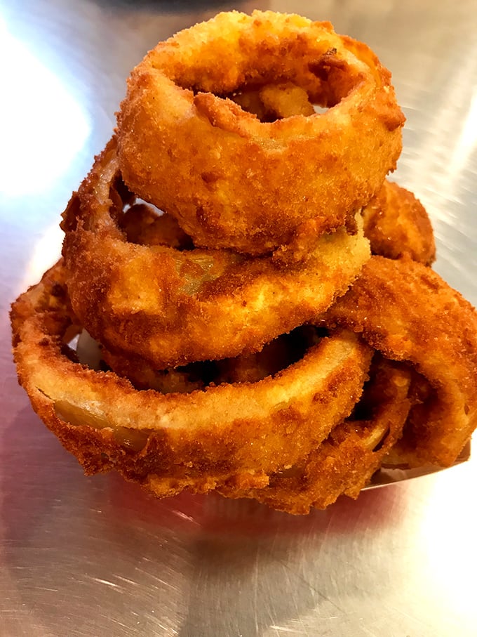 Behold, the golden rings of joy! These onion rings are so perfectly crispy, they deserve their own theme song.