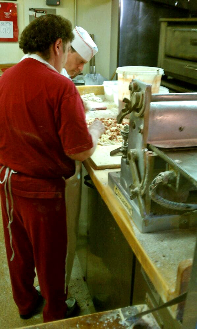 Where the magic happens! This open kitchen is like a theater of deliciousness, with pizza artisans crafting edible masterpieces before your eyes.