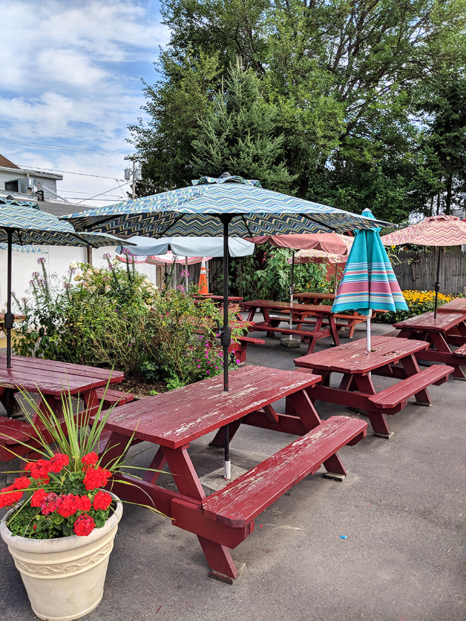 Al fresco dining, Gus's style! Picnic tables, umbrellas, and the promise of delicious eats – summer never tasted so good.