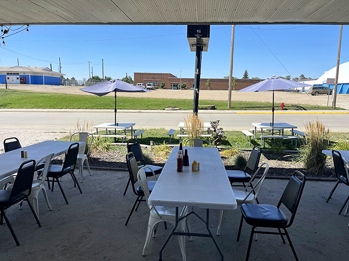 Al fresco dining with a side of small-town charm. This outdoor seating area is perfect for soaking up sunshine and local flavor.