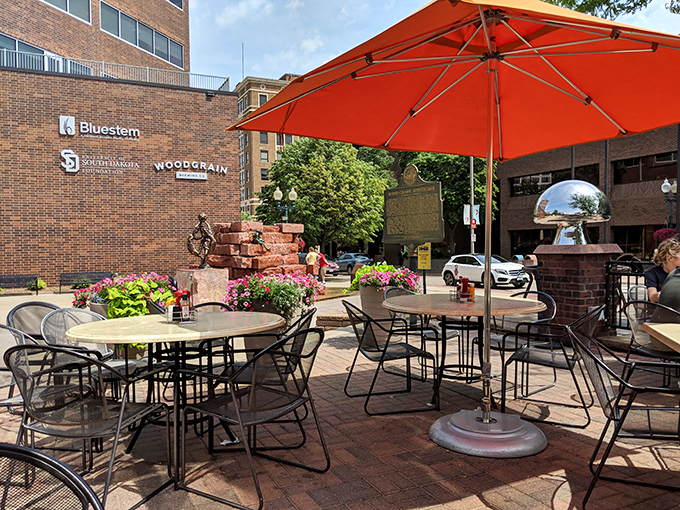 Al fresco dining with a side of people-watching. Who needs Netflix when you've got this prime entertainment with your meal?