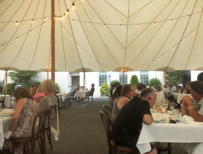 Al fresco dining with a side of twinkle! Under this magical tent, every meal feels like a beachside soir&eacute;e, minus the sand in your shoes.