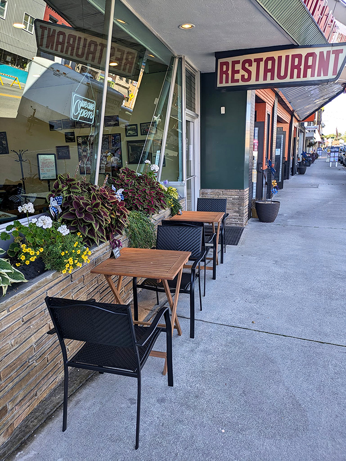 Sidewalk seating surrounded by cheerful flowers&mdash;because sometimes breakfast tastes even better with a side of fresh air and people-watching.