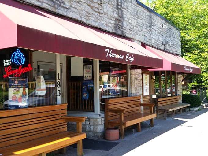 Sunshine, benches, and the promise of burgers inside. It's like waiting for a rollercoaster, but the thrills are all in your mouth.