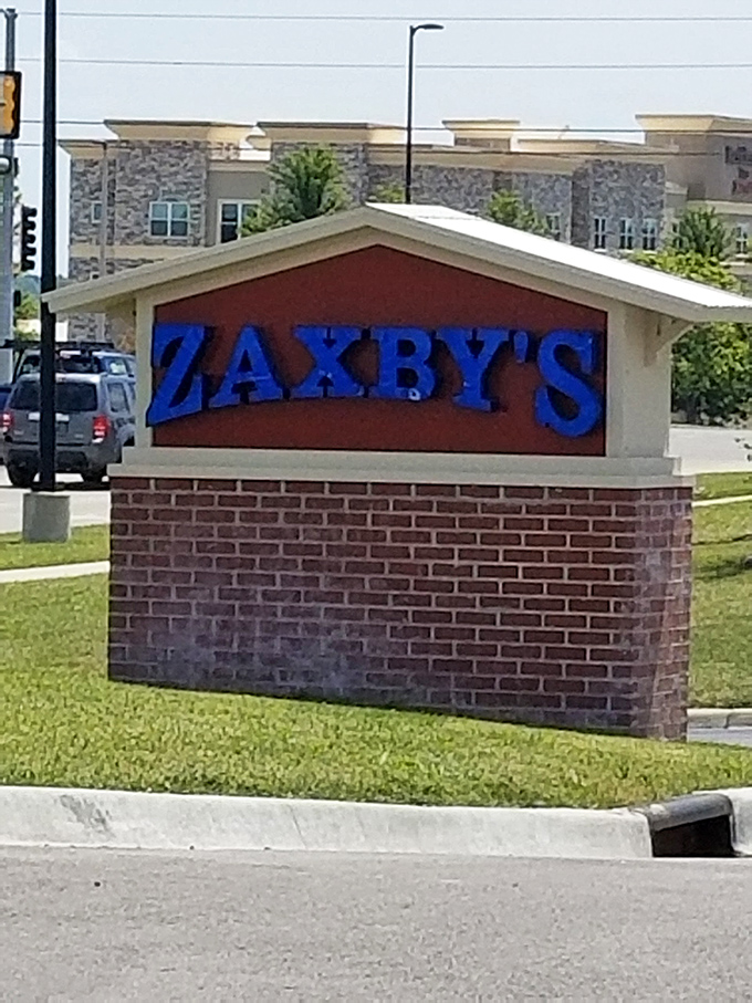 The bat-signal for hungry heroes! This sign stands tall, a beacon of hope for empty stomachs everywhere.