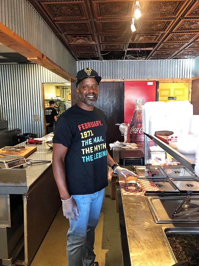 Meet the maestro of meat! This pitmaster's smile is as warm as his smoker, and twice as inviting.