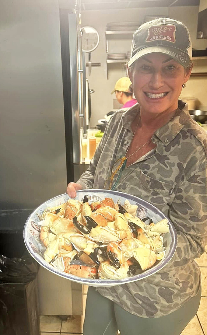 Meet the captain of this culinary ship! Her smile says "Welcome aboard," but her eyes say "I've got the best seafood this side of the Atlantic."