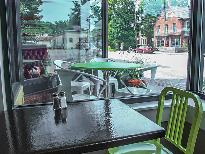 A window to Main Street magic. Watch the world go by as you contemplate life's big questions, like "One more slice?"