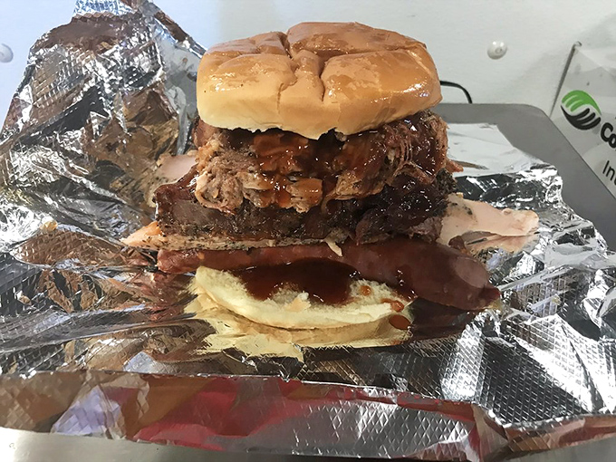 The Leaning Tower of Deliciousness! This towering sandwich is stacked higher than your grandpa's tales of "walking uphill both ways."