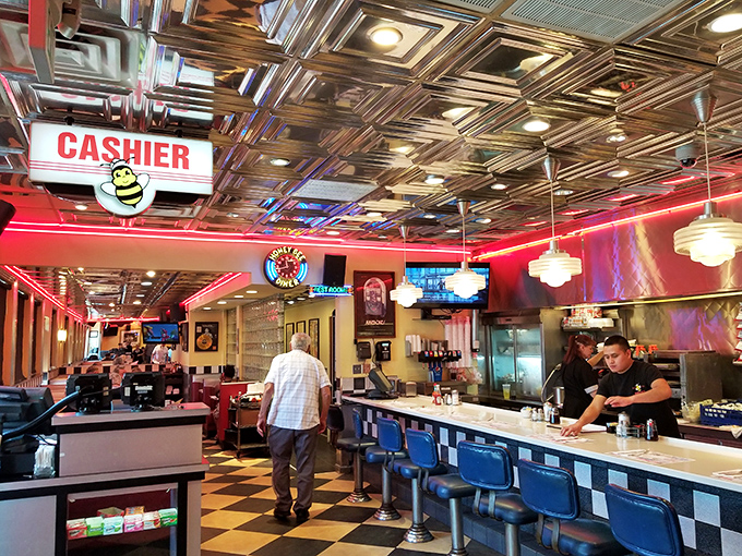 The heart of the hive: where milkshakes are born and diet plans go to die. Grab a stool and watch the magic happen!