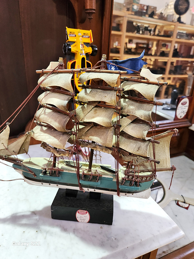 Ahoy, miniature mateys! This model ship is ready to set sail on your mantelpiece. It's the perfect conversation starter for landlubbers and sea dogs alike.
