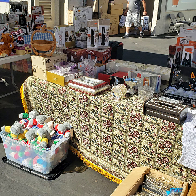 Curio cabinet of curiosities! From plush pals to vintage vino accessories, this booth is a smorgasbord of whimsy and wonder.