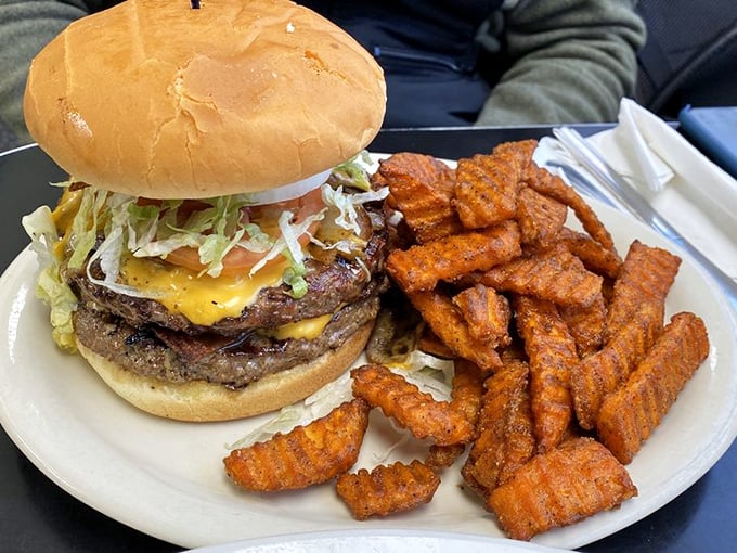 Burger so tall it needs its own zip code, with a side of fries that could double as Lincoln Logs. Now that's architecture!