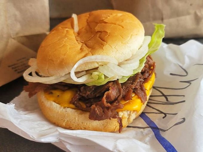 Behold, the HAL 9000 of burgers! This stack is so perfect, it might just become self-aware.