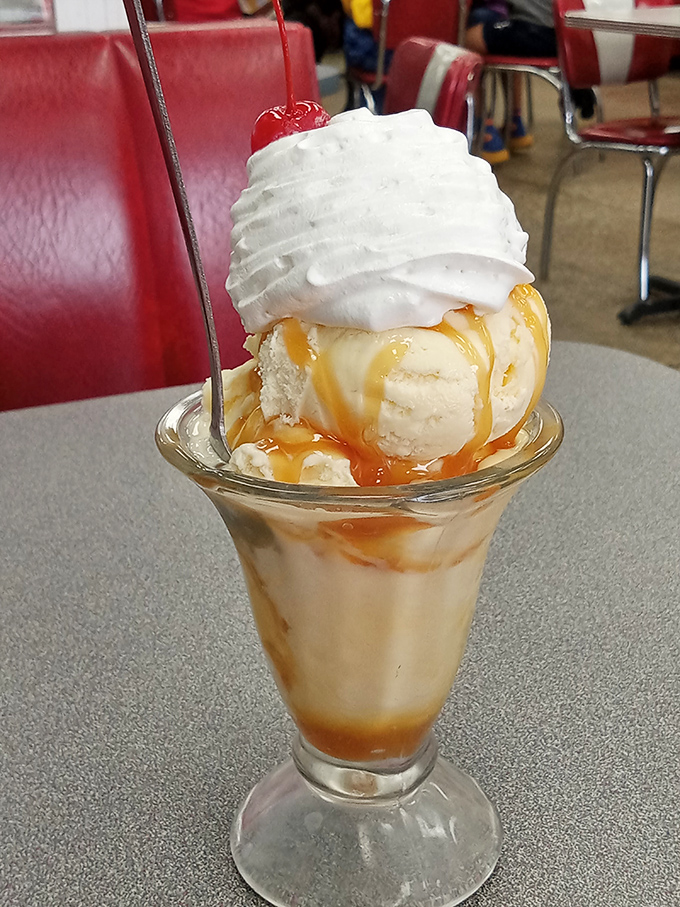 Caramel waterfall meets ice cream mountain. Is this dessert or a geography lesson? Either way, I'm grabbing my spoon-shaped expedition gear!